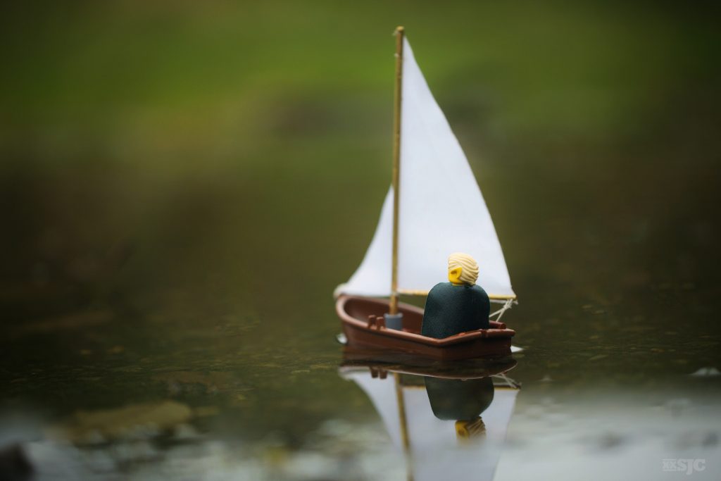 lego-sailboat-puddle-outdoors-reflection - Toy Photographers